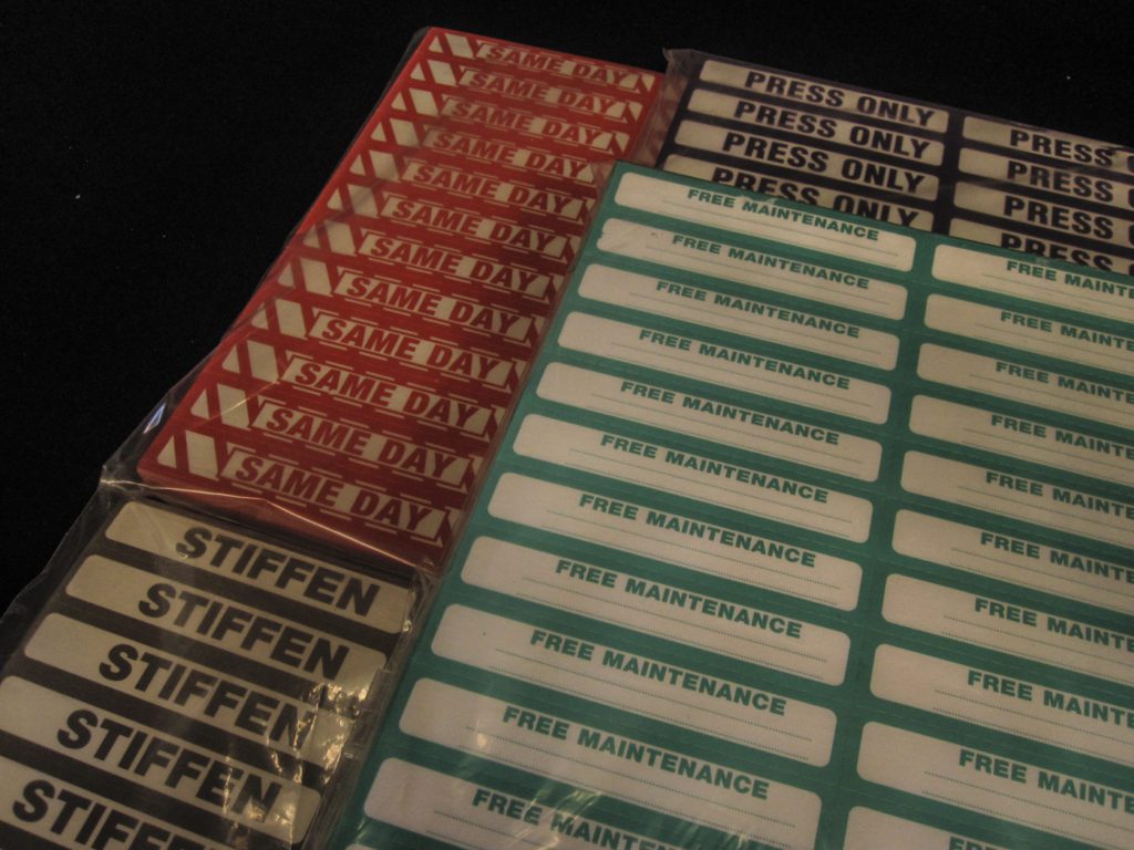 Flag Tags - Universal Drycleaning Solutions